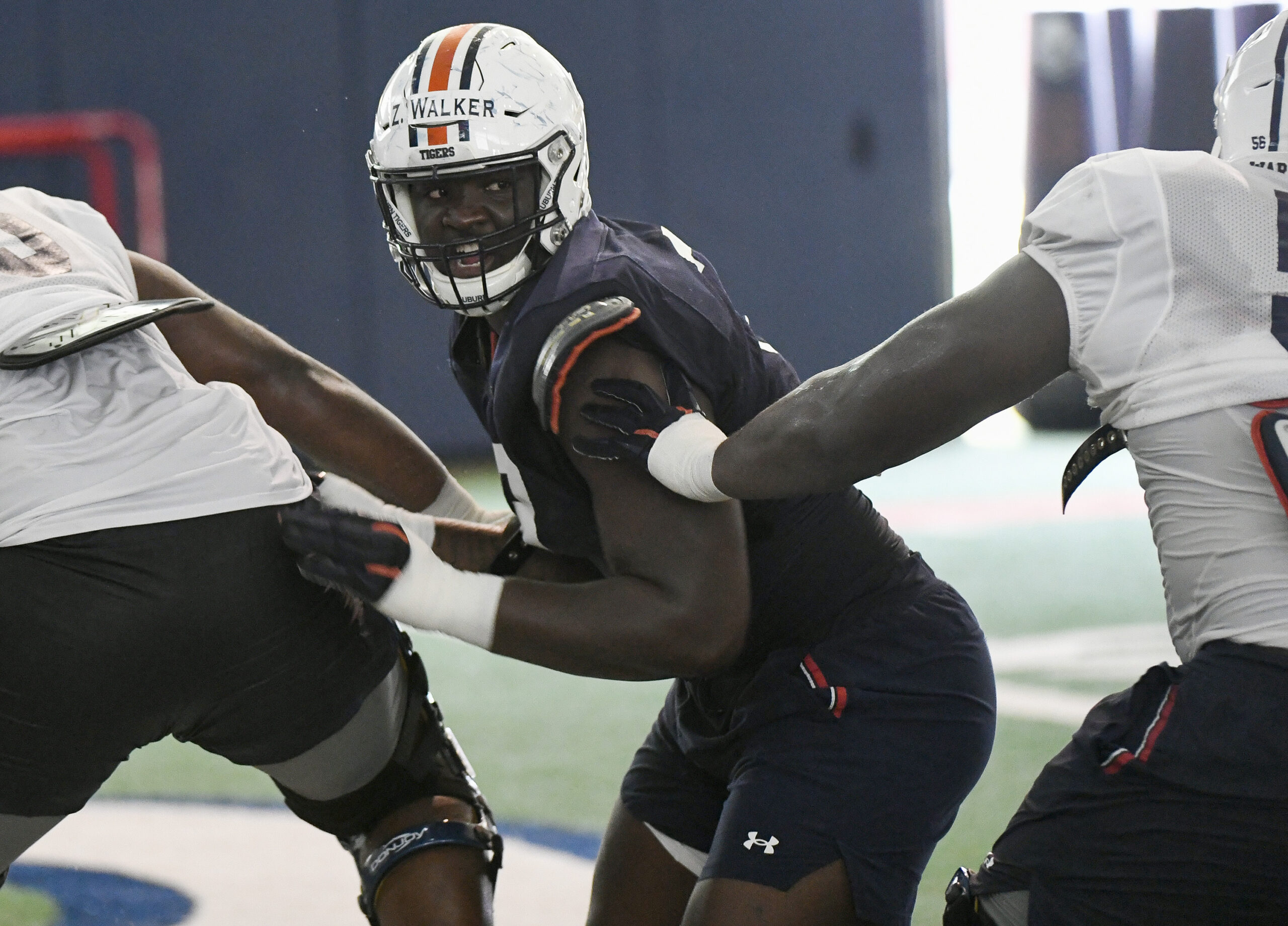 Walker withdraws from portal, where he fits in Roberts' defense?