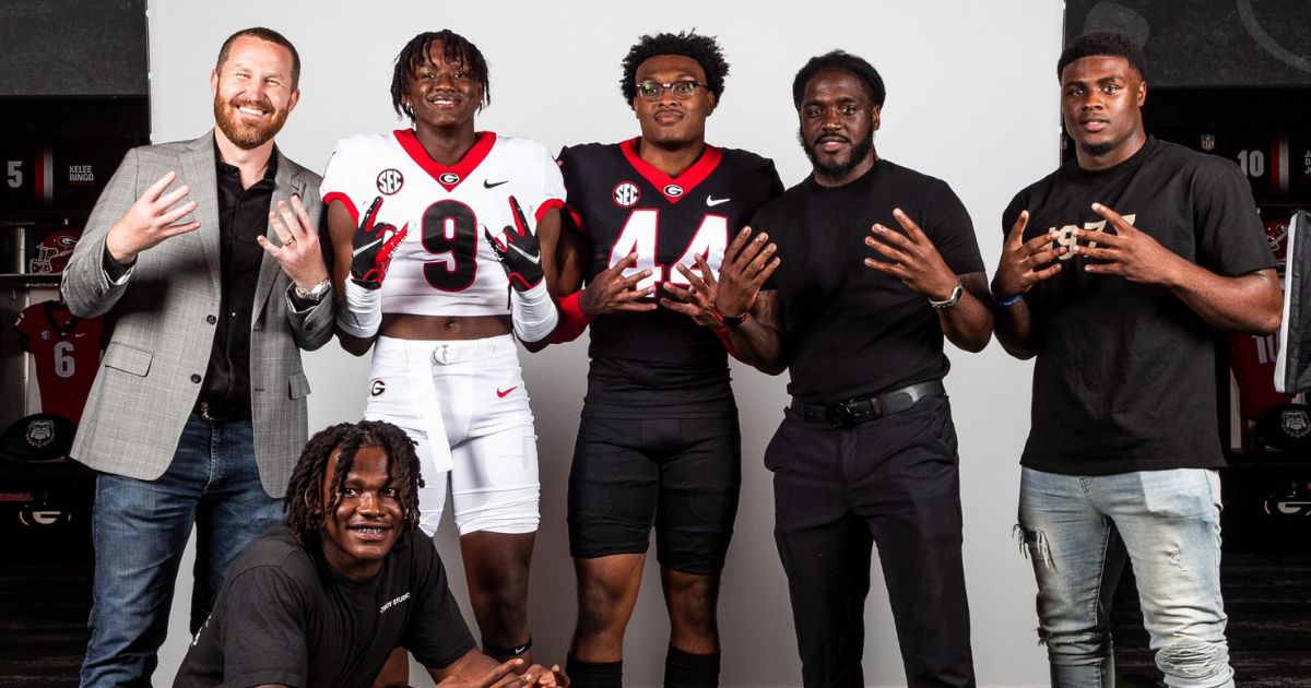 Georgia official visitors show off for uniform photo shoot