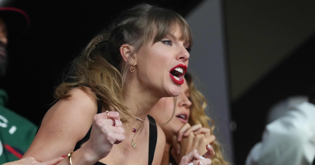 Taylor Swift chugs drink while on jumbotron at Super Bowl LVIII