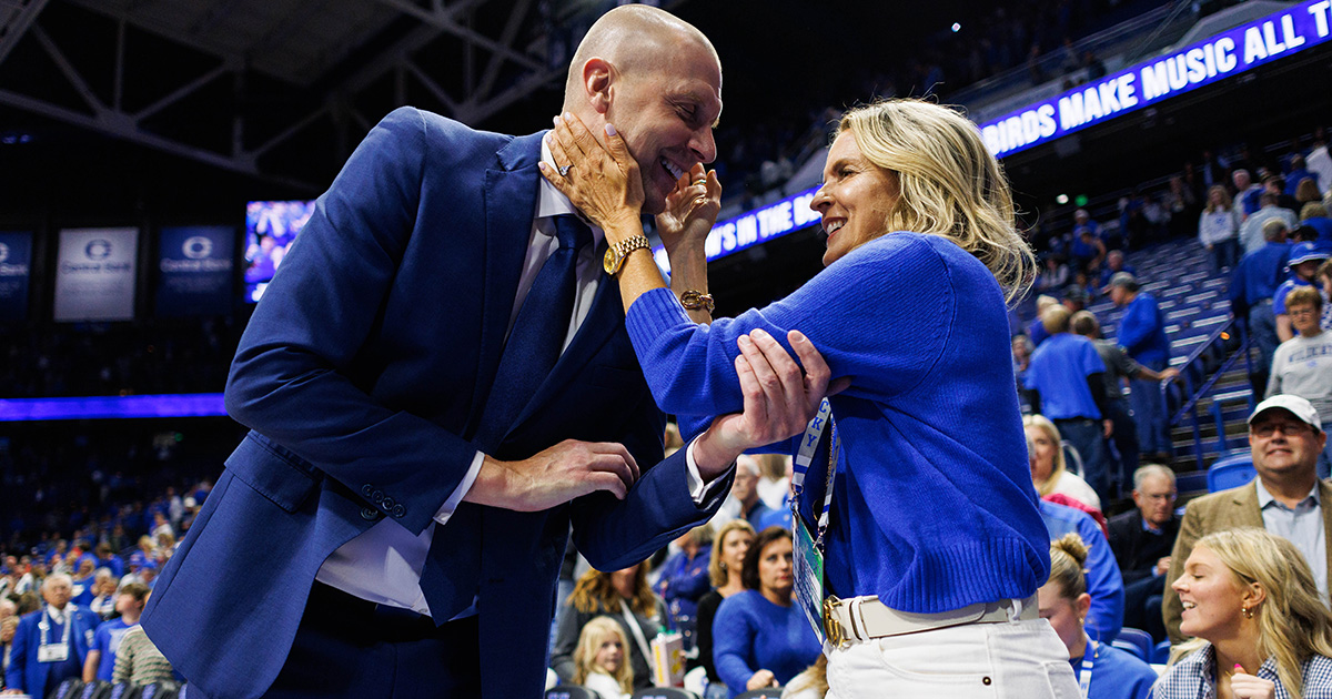 Mark Pope embraces wife Lee Anne, celebrates with fans after Duke win - On3