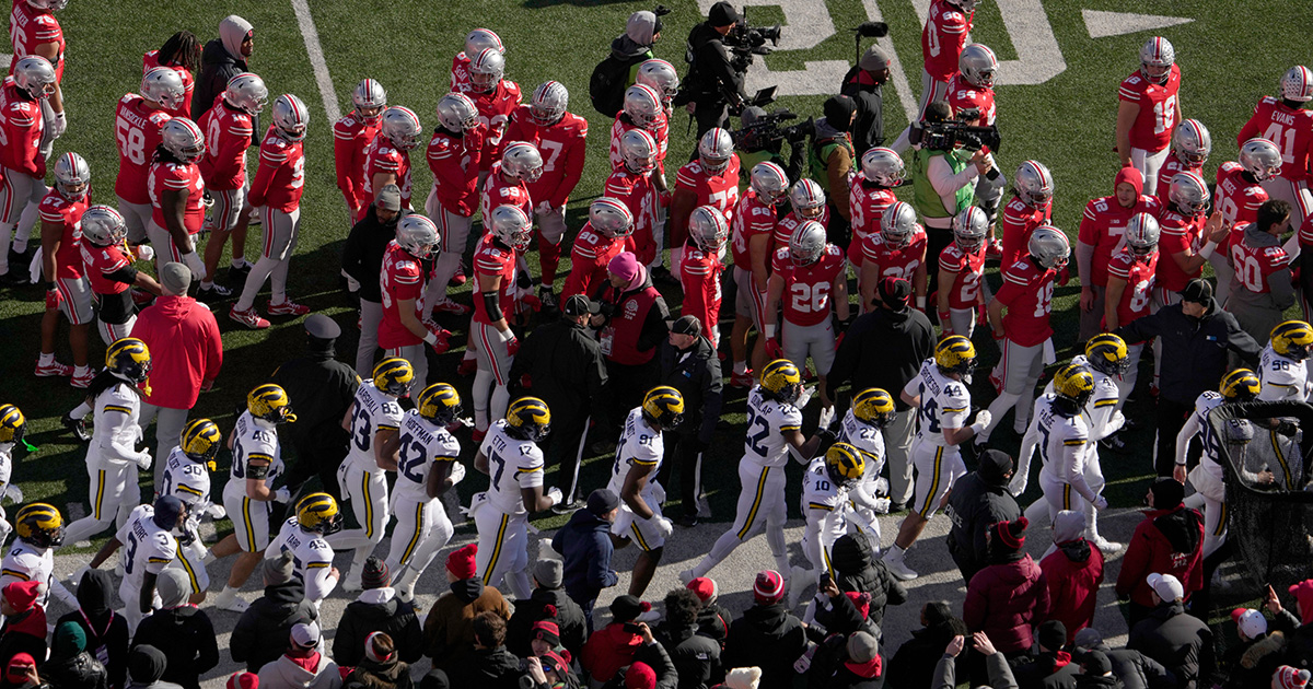The Game brawl: Players appear to be pepper sprayed on field after Michigan, Ohio State fight - On3